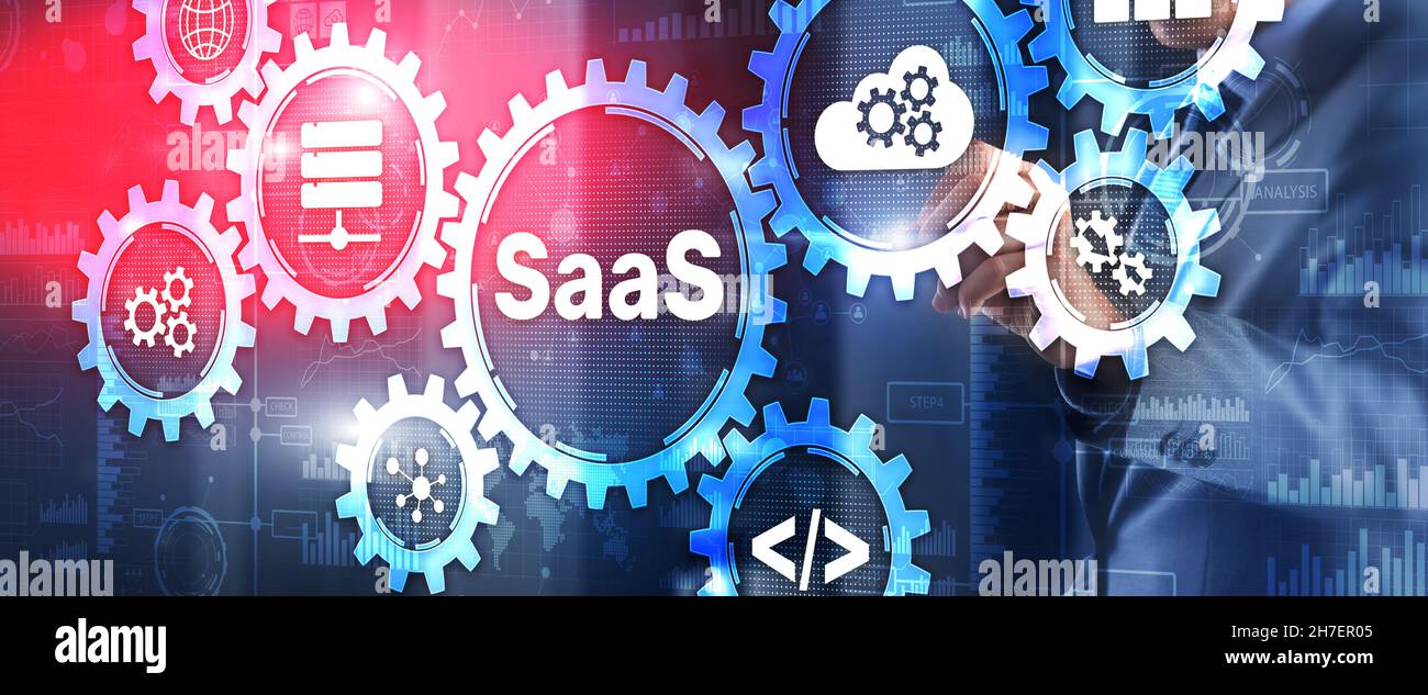 SaaS Software as a Service concept with hand pressing text Stock Photo - Alamy