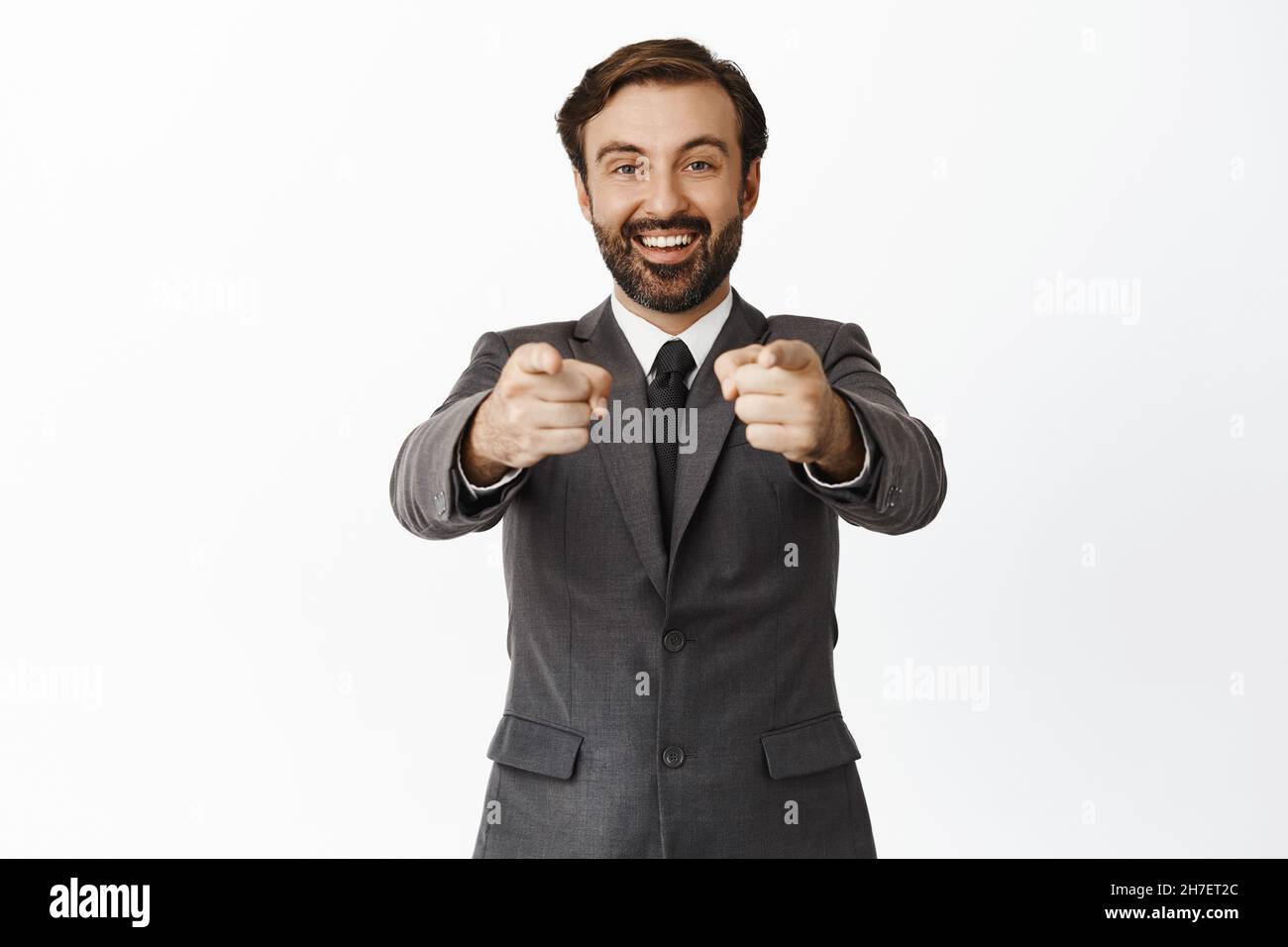 Its you. Enthusiastic corporate man, office manager pointing at camera ...
