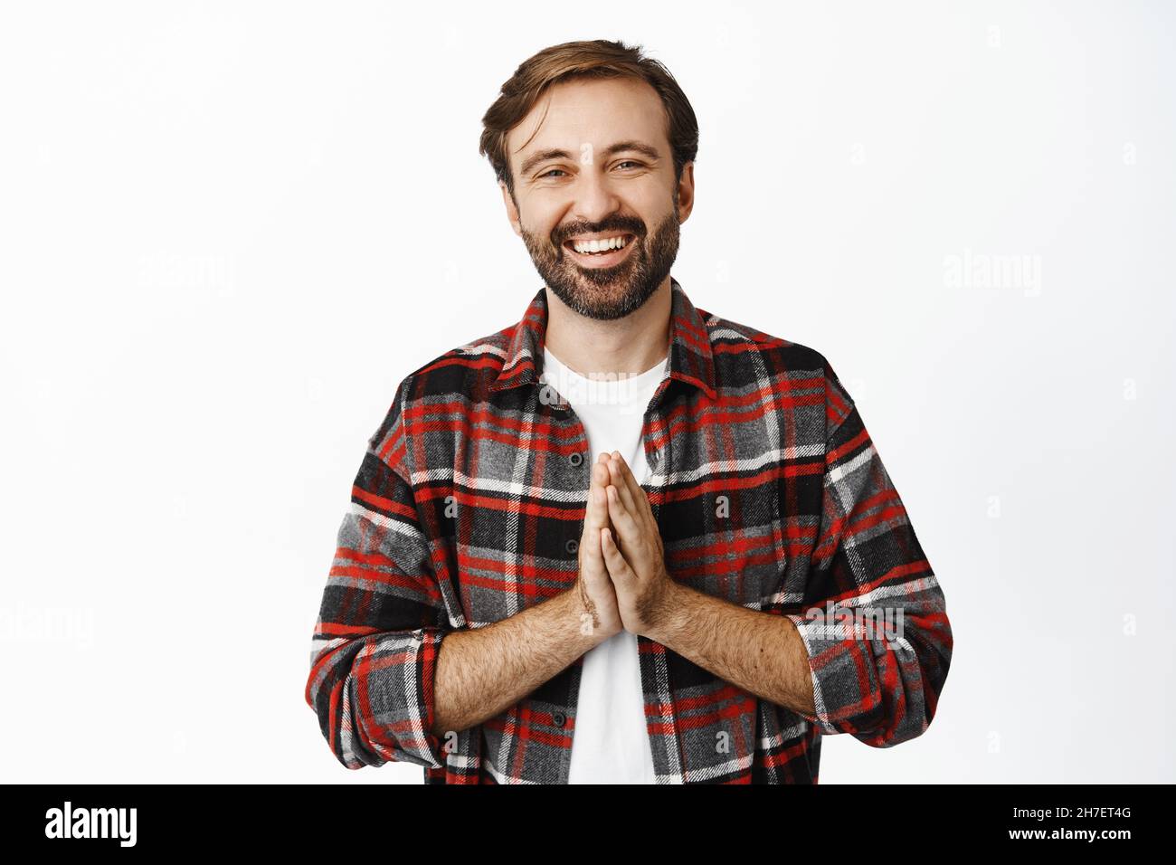 Smiling happy adult man say thank you, shows namaste appreciation ...