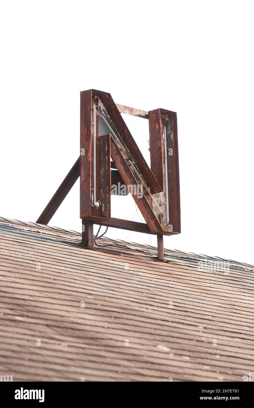 Big rusty dilapidated rooftop sign of the letter "N Stock Photo - Alamy