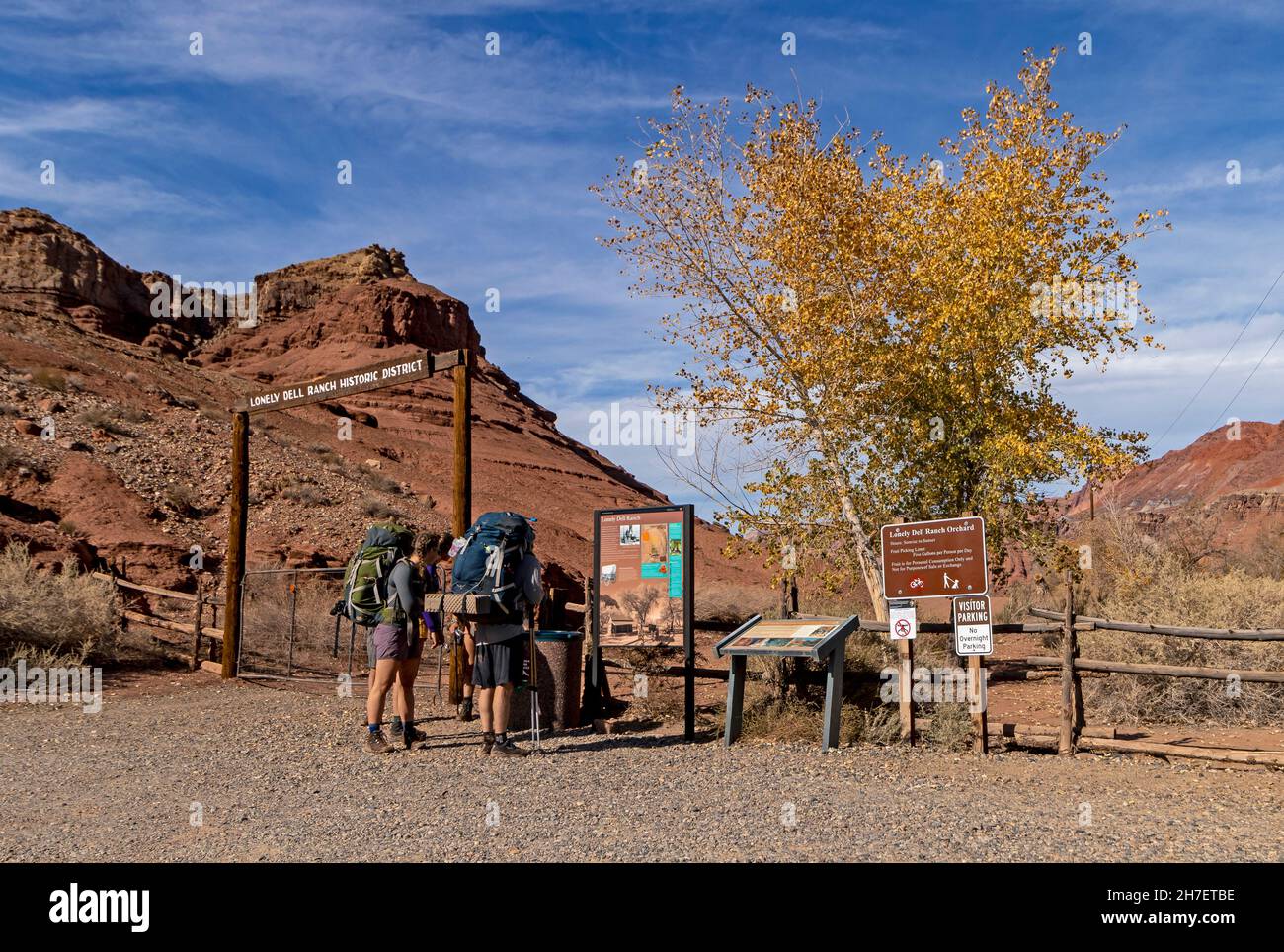 Desert landscape image showing a hiking trailhead with hikers heading ...