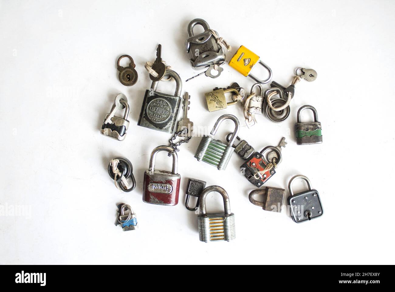 Old keys and locks isolated on a white background Stock Photo - Alamy