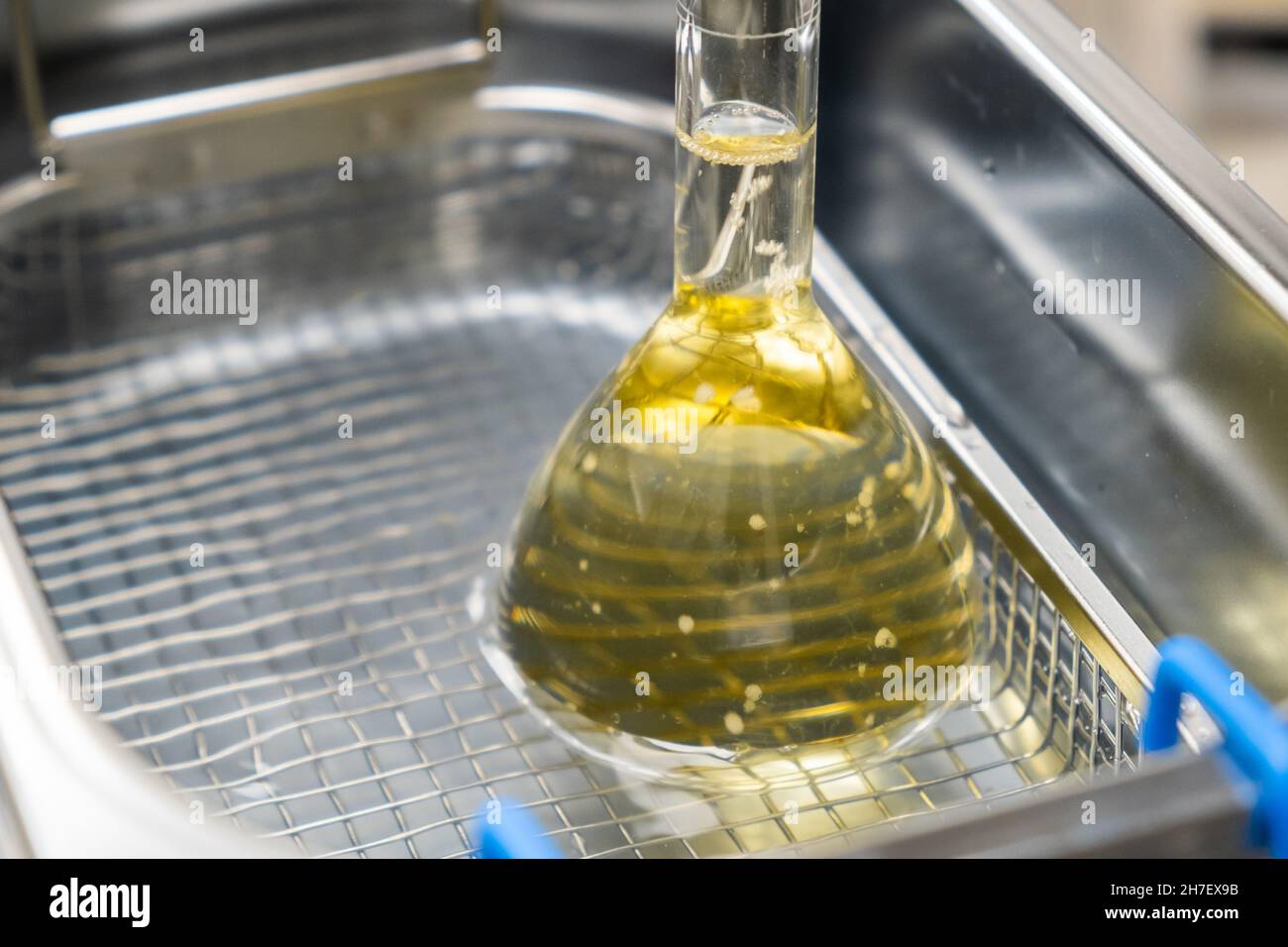 Yellow solution in the flask for dissolving or extraction into ...