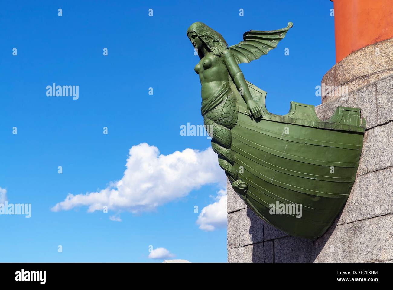 The statue at the foot of the Rostral Column. The arrow of Vasilievsky ...