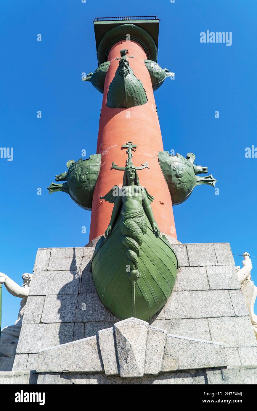 The statue at the foot of the Rostral Column. The arrow of Vasilievsky ...