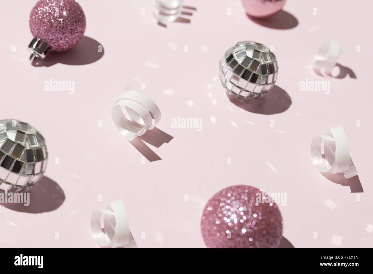 Christmas composition with fancy baubles on the pink surface Stock ...