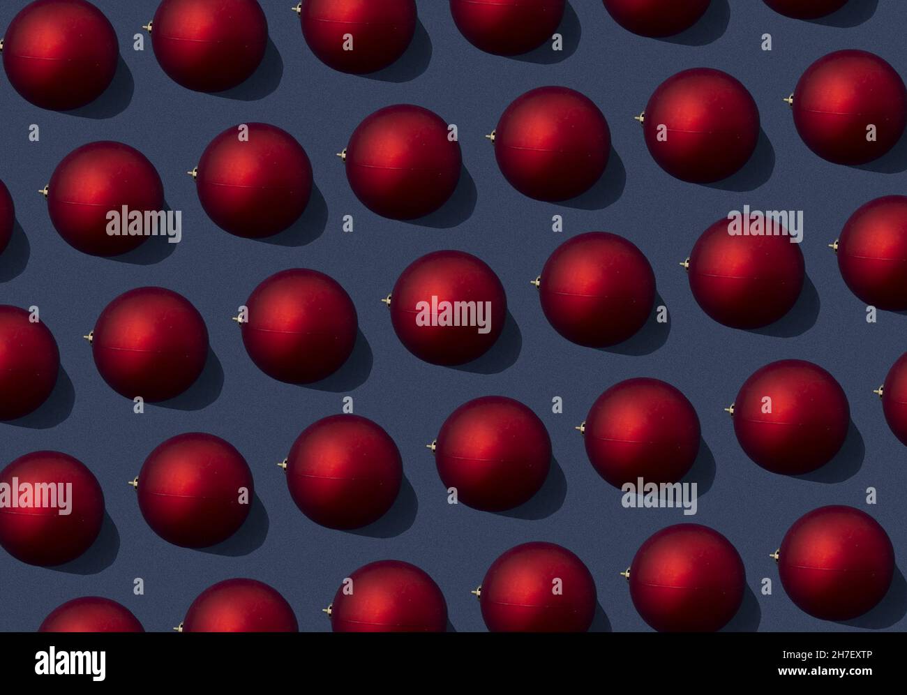 Seamless texture with red Christmas balls in the dark blue background ...