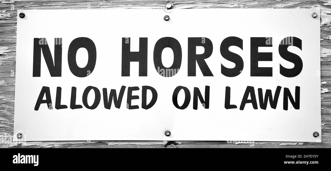 No horses allowed on lawn sign posted outdoors Stock Photo - Alamy