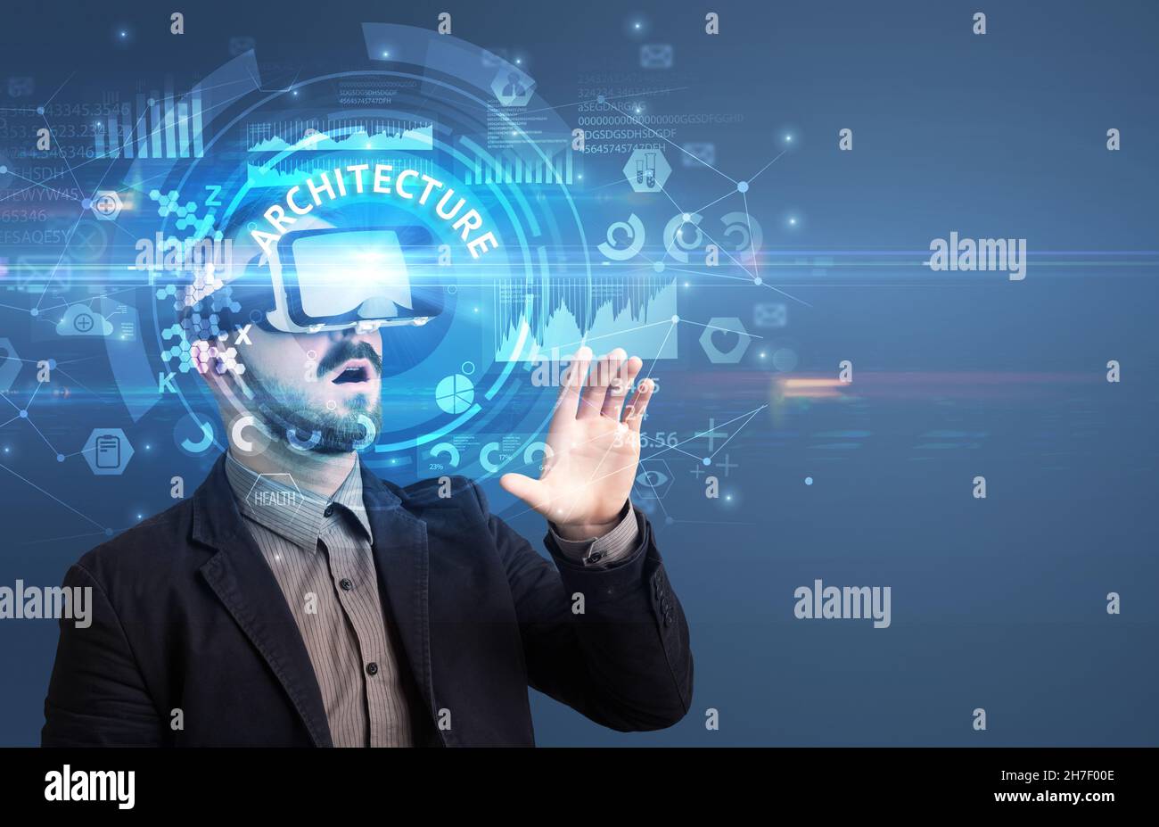 Businessman looking through VR glasses Stock Photo - Alamy
