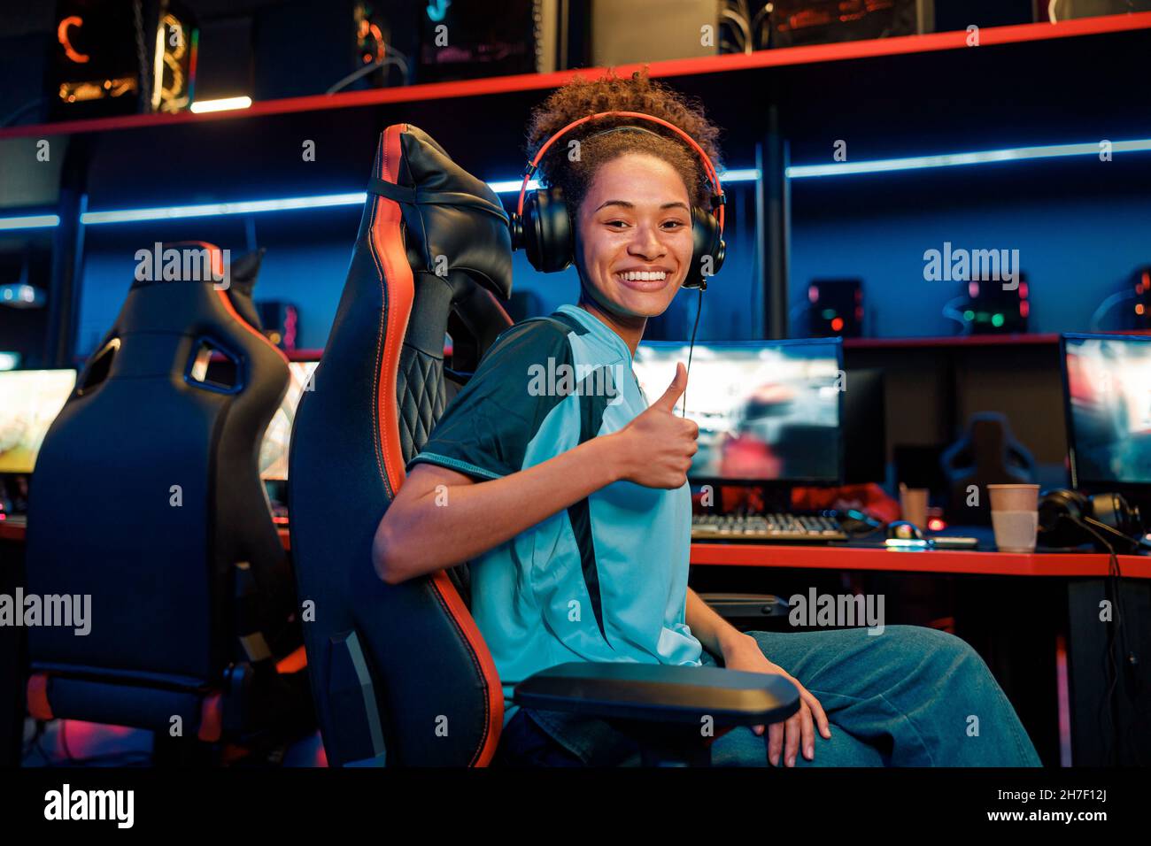 Female gamer succeed in gaming tournament in computer club Stock Photo ...