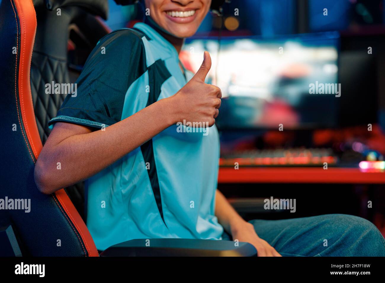 Esports gamer happy with game at tournament in computer club Stock ...