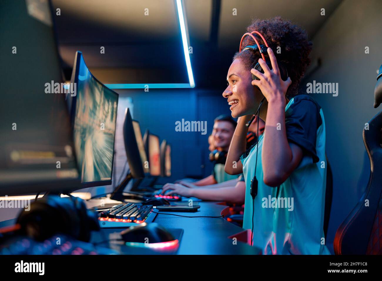 Professional gamer participates in team play in cyber club Stock Photo ...