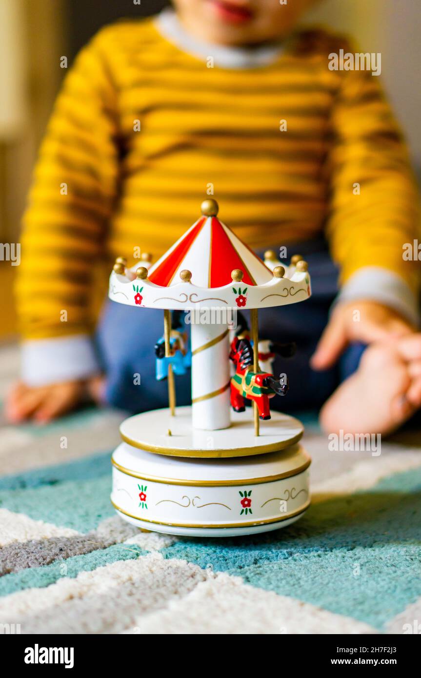 Vertical closeup of a colorful merry-go-round toy Stock Photo - Alamy