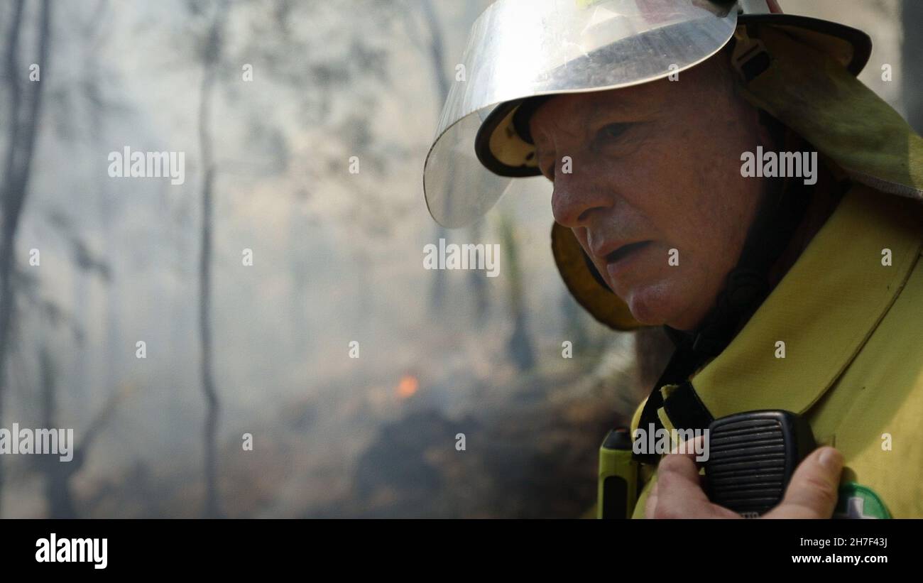 BURNING, a firefighter battling the Australian bushfires of 2019-2020 ...