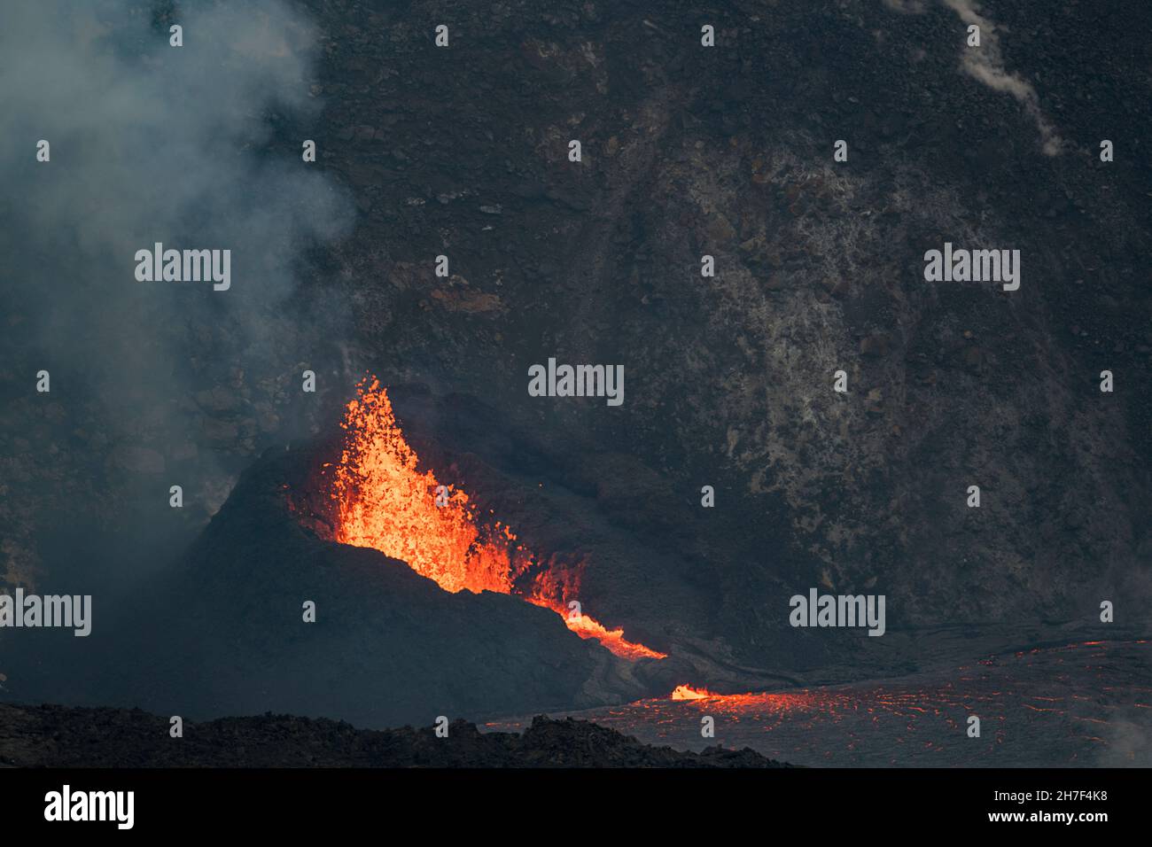 hot lava fountaining from a vent within a spatter cone feeds a growing ...