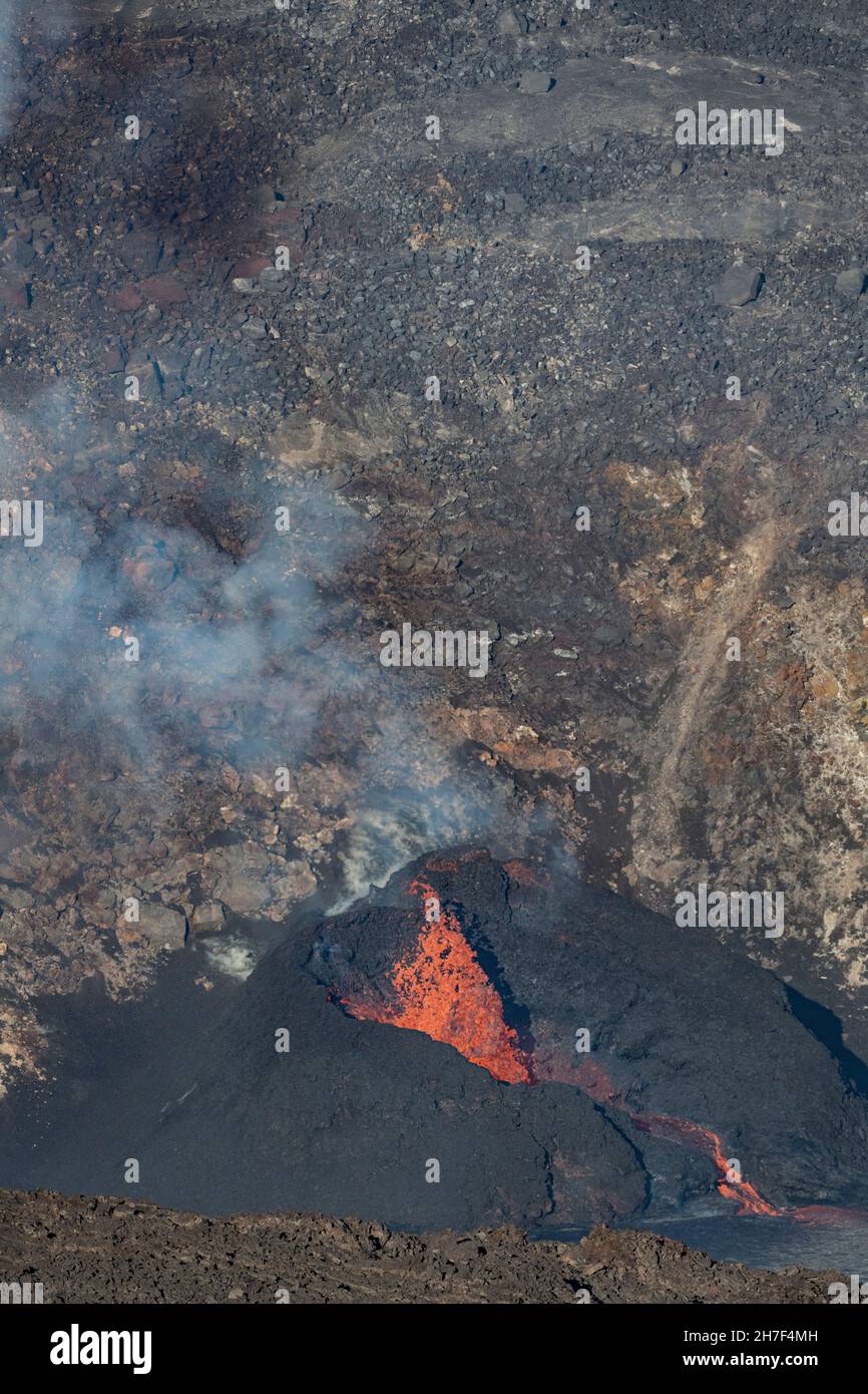 hot lava fountaining from a vent within a spatter cone feeds a growing ...