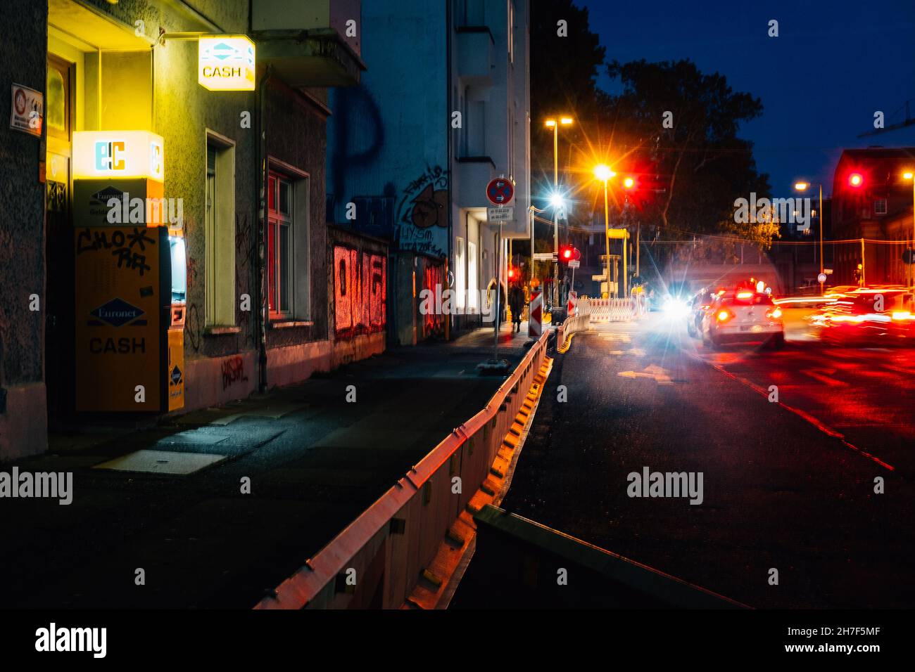 Beautiful night view of a street with cars and shops Stock Photo - Alamy