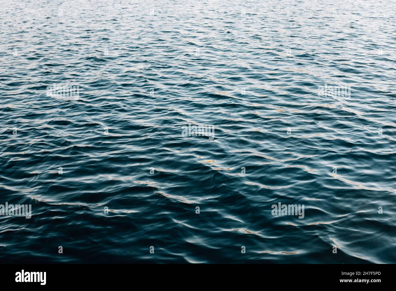 Blue ripples on the sea surface Stock Photo - Alamy