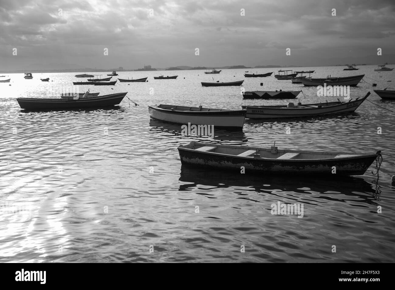 Fishing boats background ocean Black and White Stock Photos & Images ...