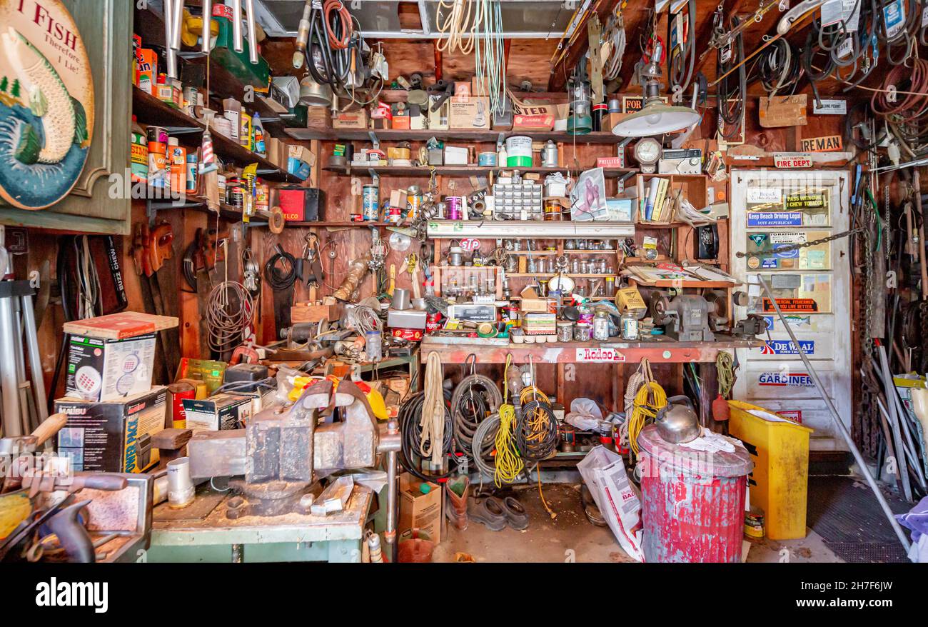 Garage workshop filled with tools and junk Stock Photo - Alamy