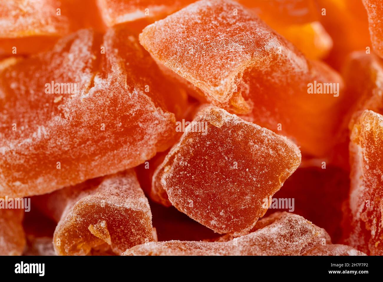 Close-up of Natural farm homemade candied pumpkin fruits sprinkled with ...