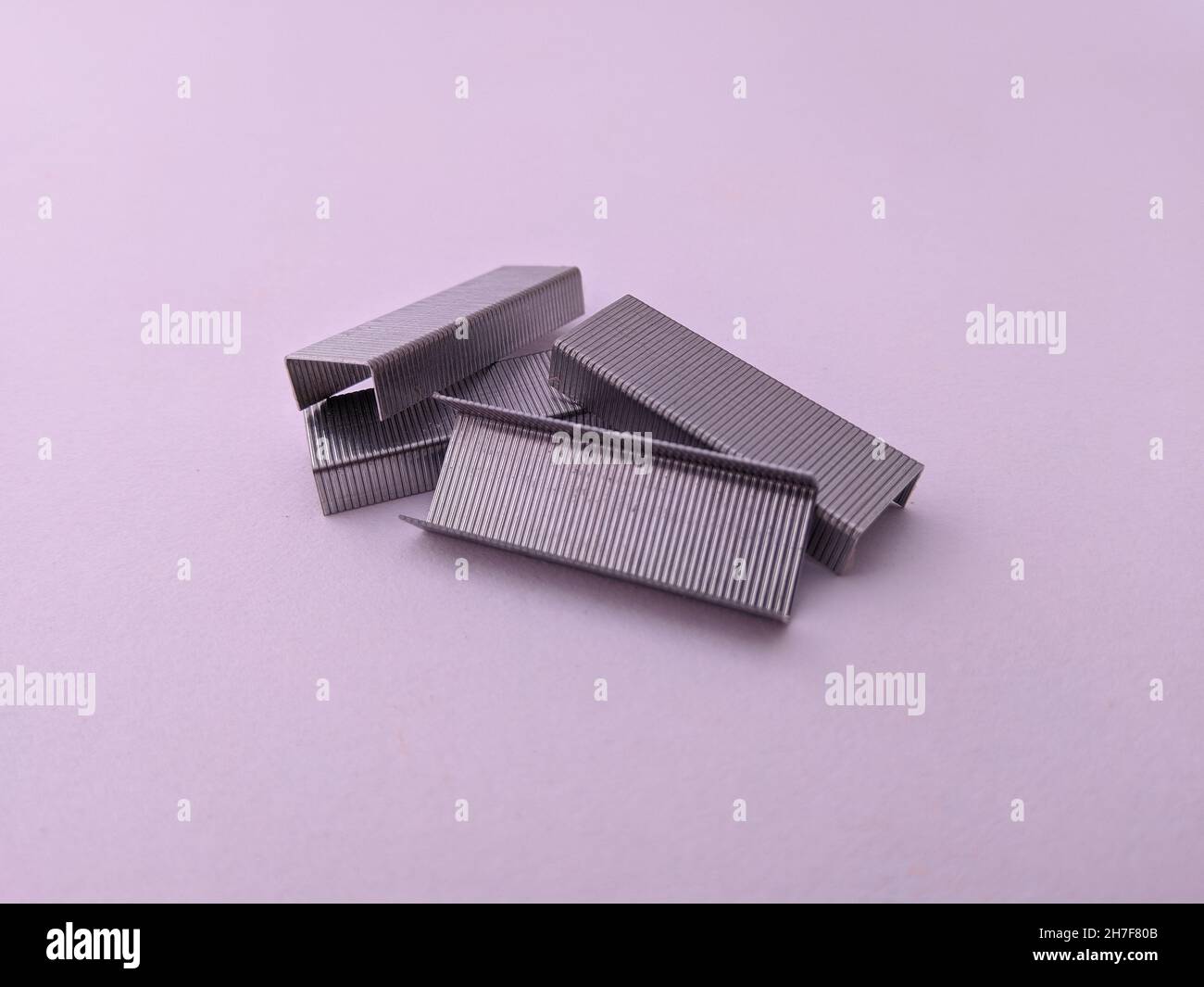 Closeup of staples on a white background Stock Photo - Alamy
