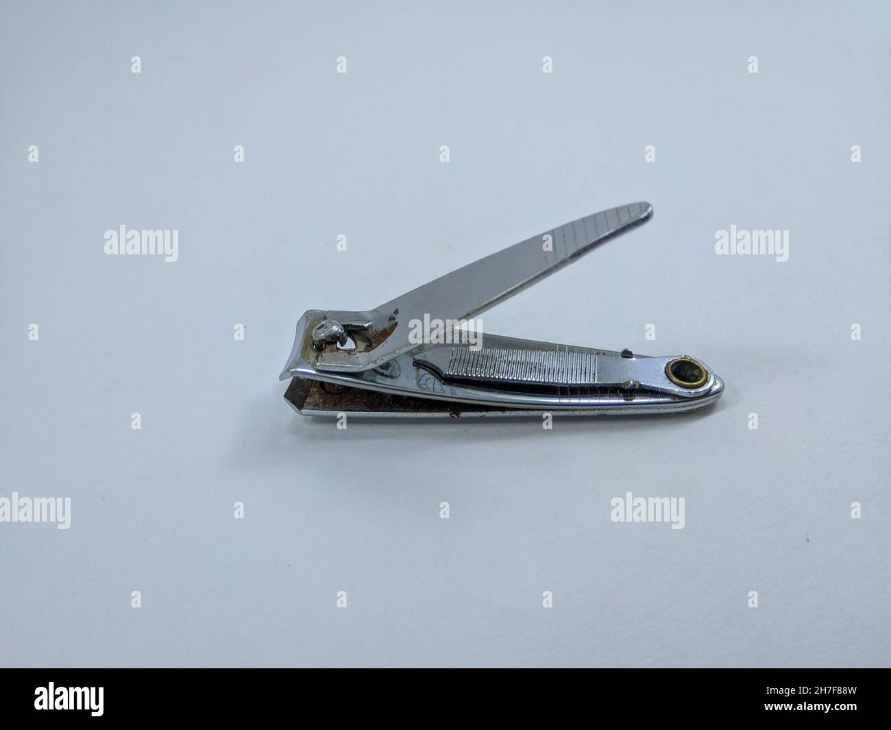 Closeup of a rusty nail clipper on a white background Stock Photo - Alamy