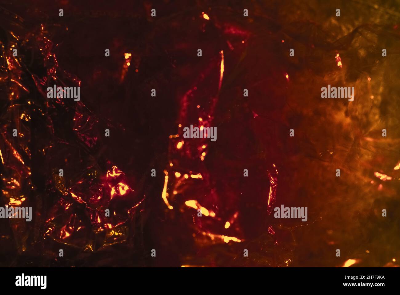 Abstract red background shiny crumpled hologram with sparkles. Trendy ...