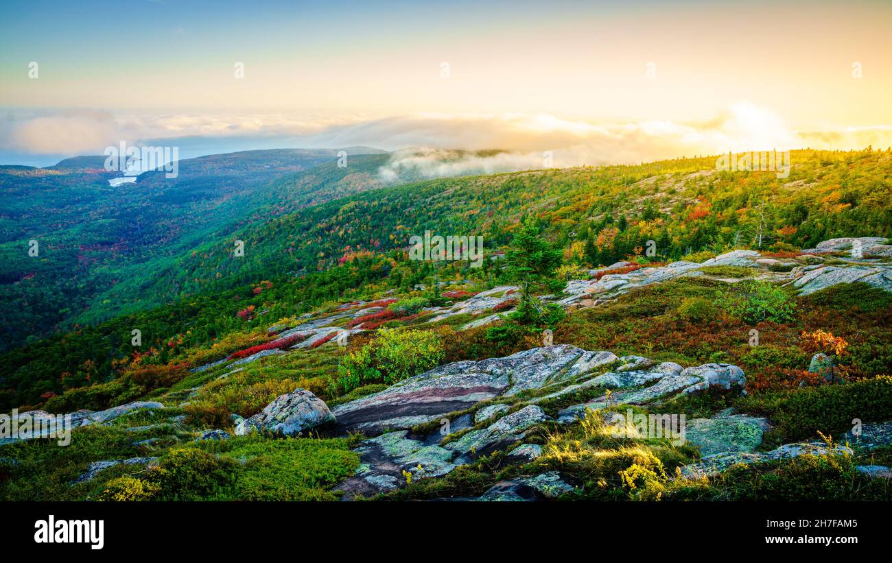 Fog in rising from the sea and the valleys as seen from the top of ...