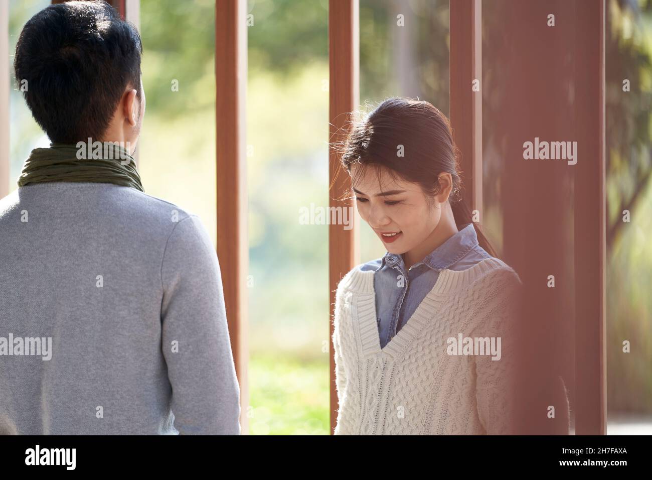 Talking shy hi-res stock photography and images - Alamy