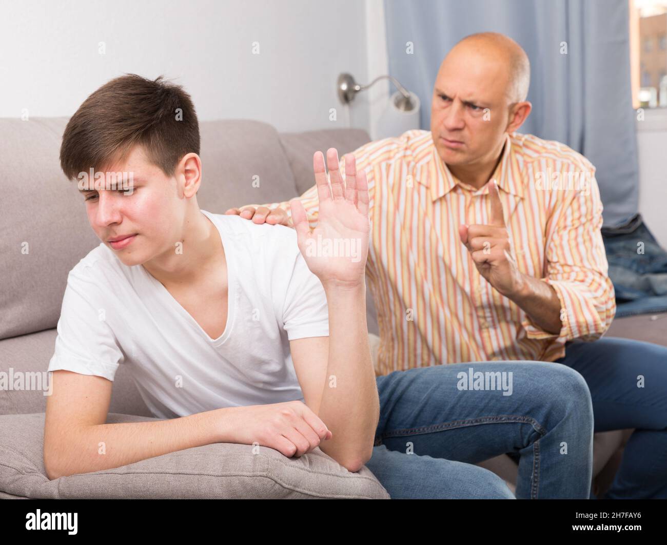Son making stop gesture to father Stock Photo - Alamy Son making stop gesture to father Stock Photo - Alamy