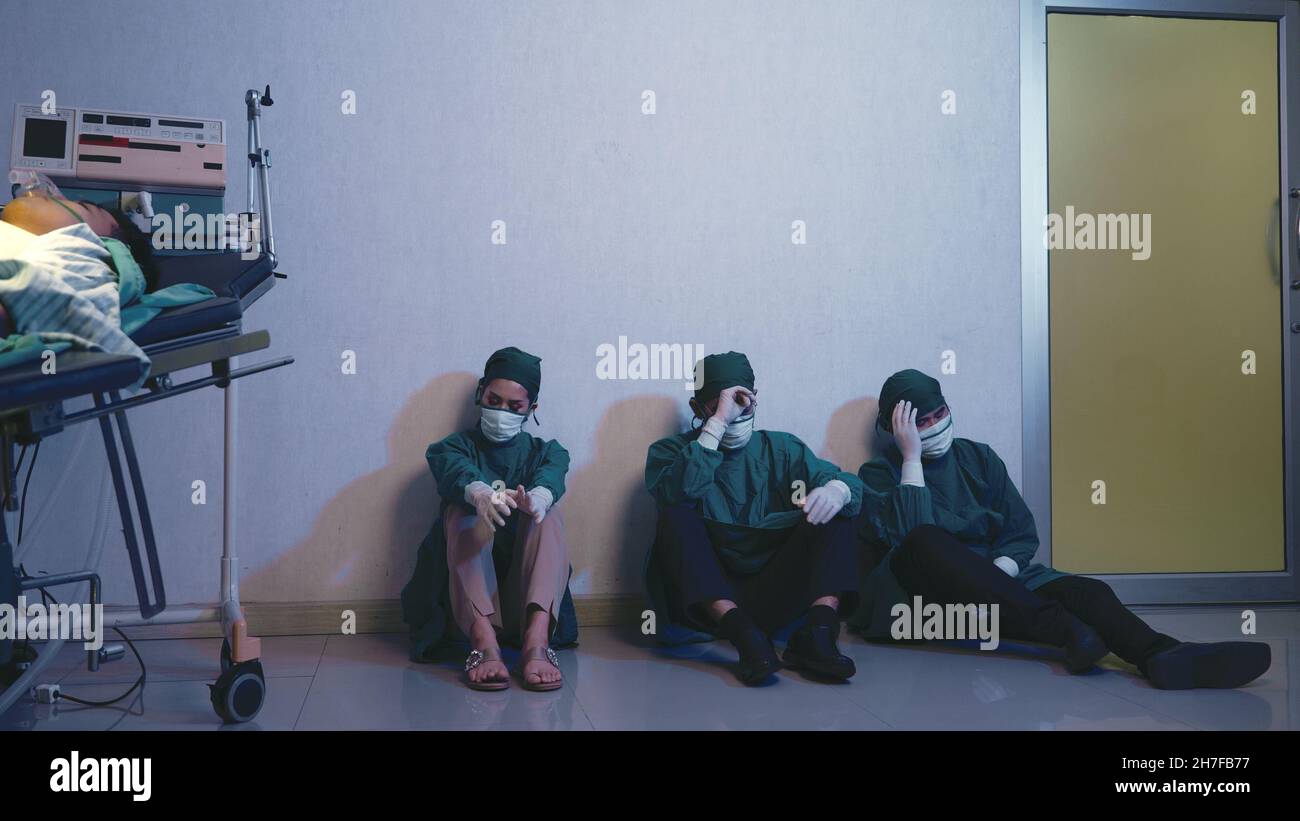 Tired doctor, Group of surgery doctors sadness fatigue after surgery ...