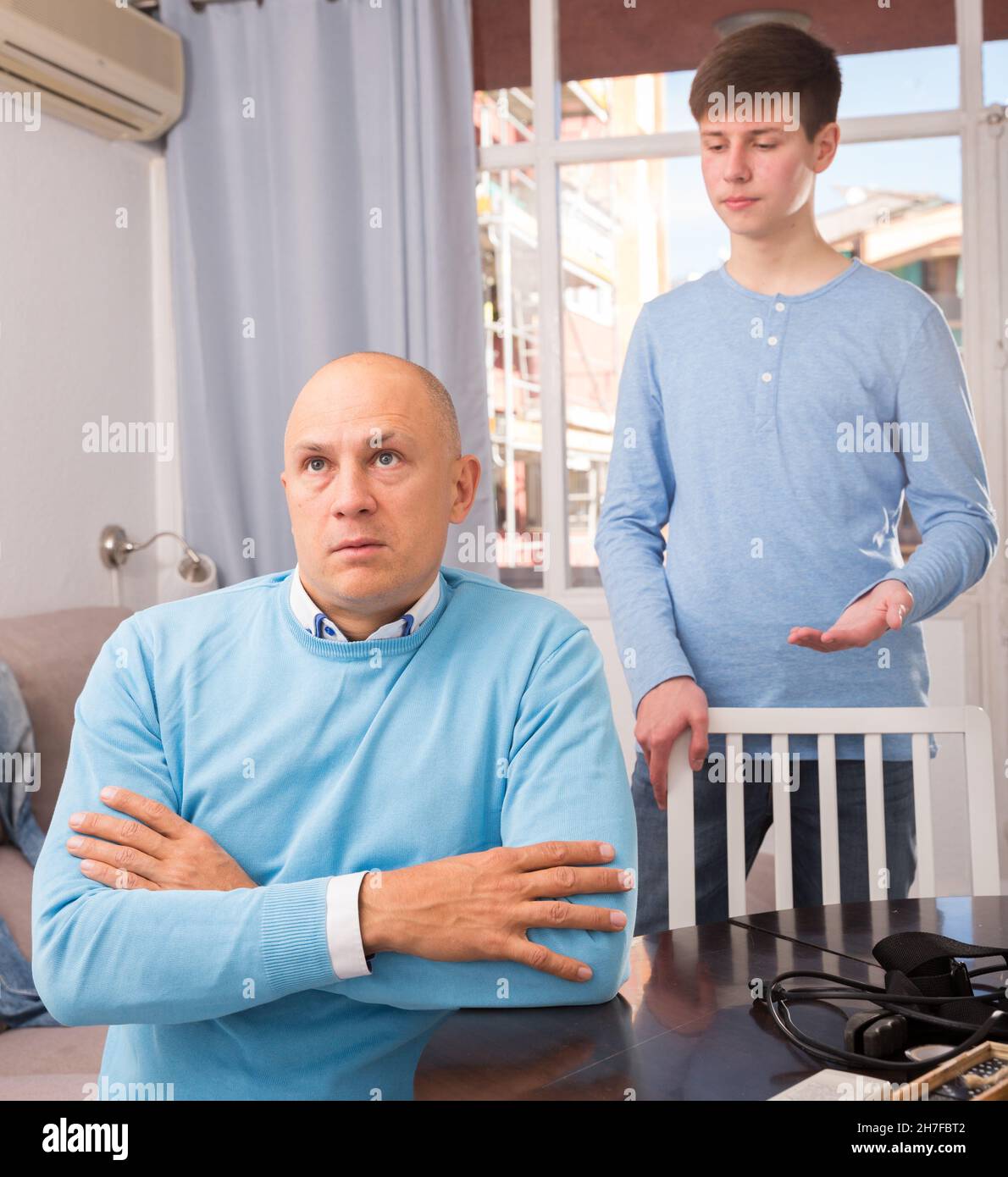 Upset father turned away Stock Photo - Alamy