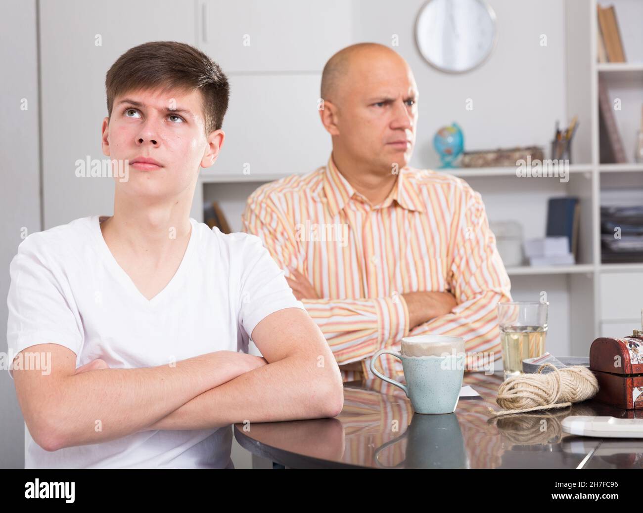 Father and teenage son after quarrel Stock Photo - Alamy