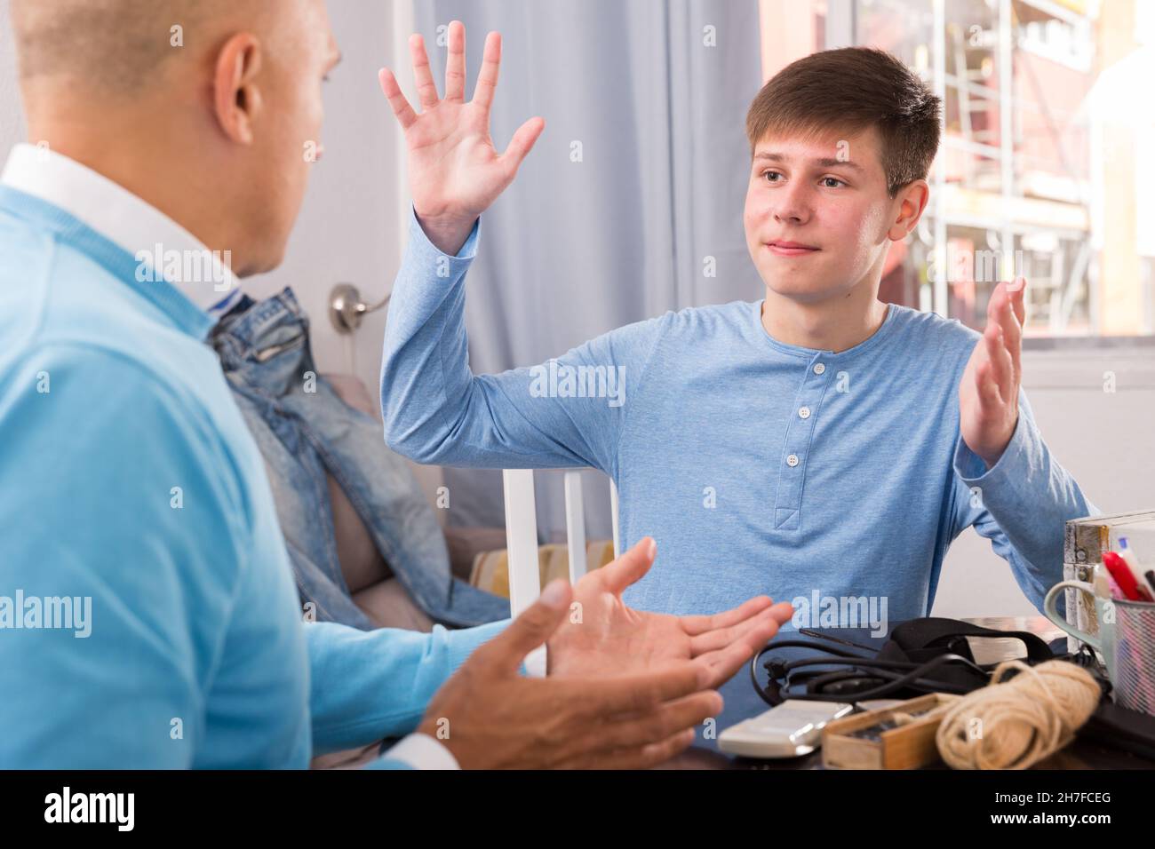Man and his son talking at home Stock Photo - Alamy