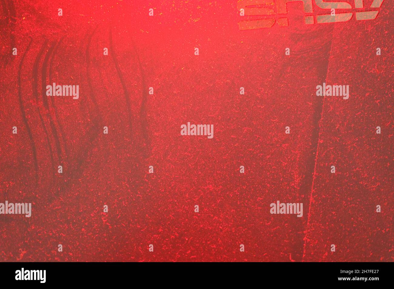 Red light standing on metal surface that is covered by dust and light ...