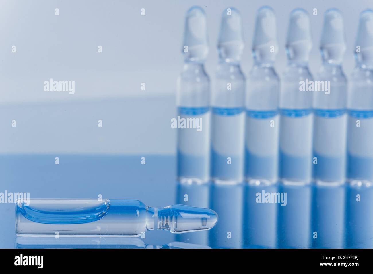 Glass medical ampoule vial for injection. Medicine is liquid sodium ...