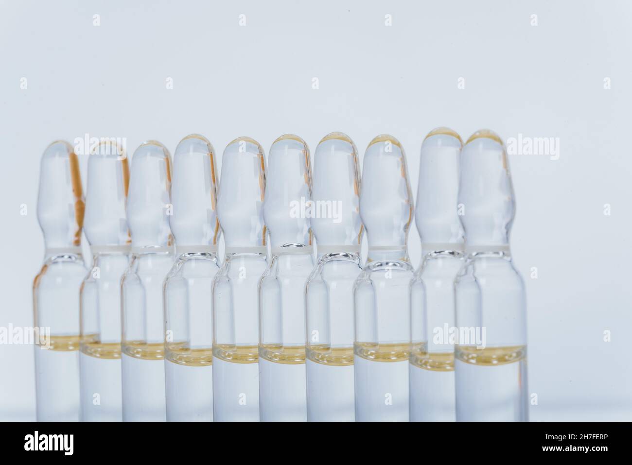 Glass medical ampoule vial for injection. Medicine is liquid sodium ...