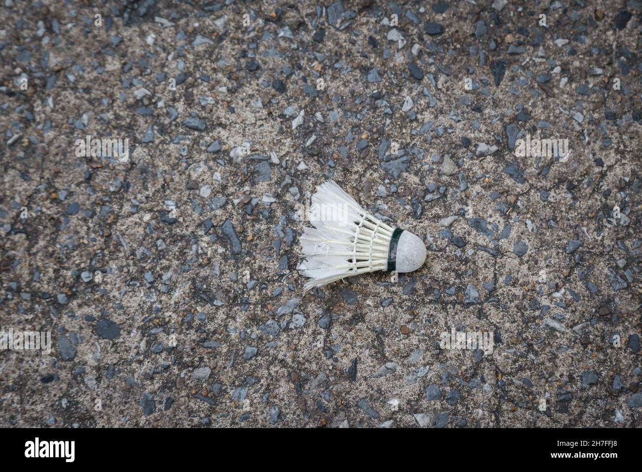 Old damage shuttlecock ,badminton ball on the floor background Stock ...