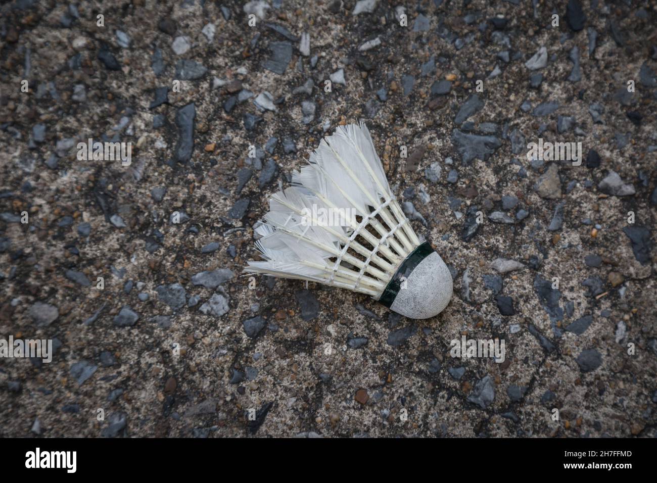 Old damage shuttlecock ,badminton ball on the floor background Stock ...