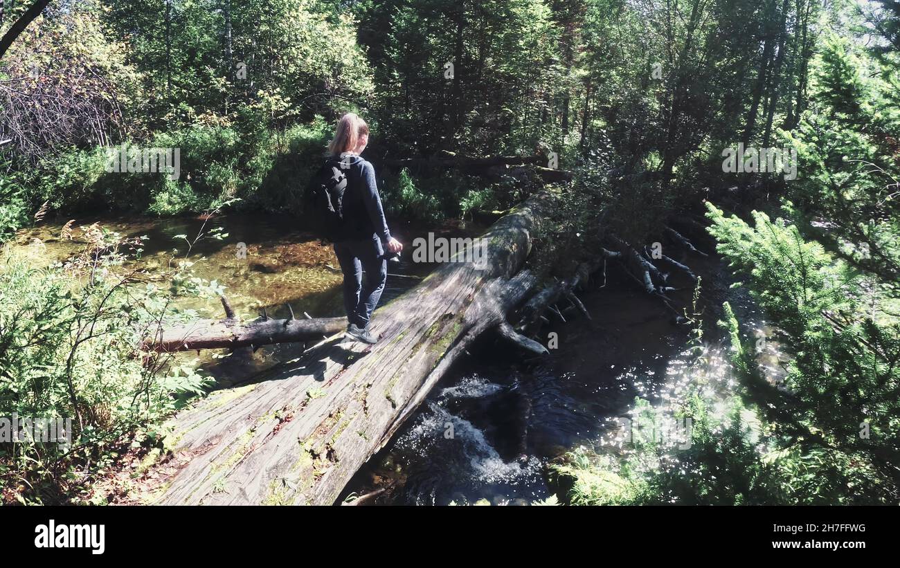 Back woman backpack wood bridge hi-res stock photography and images - Alamy