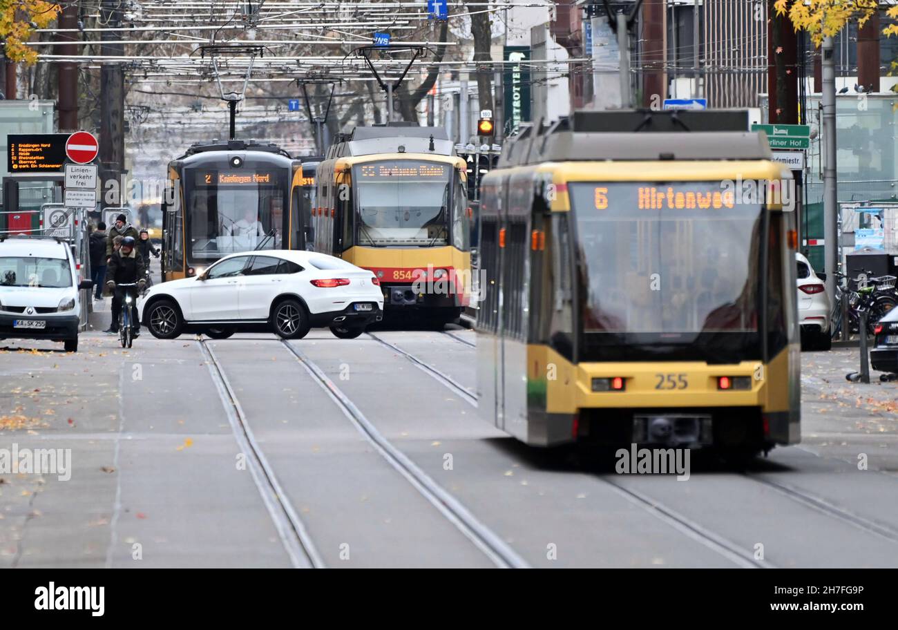 Karlsruhe, Germany. 21st Nov, 2021. Trams drive through the city center ...