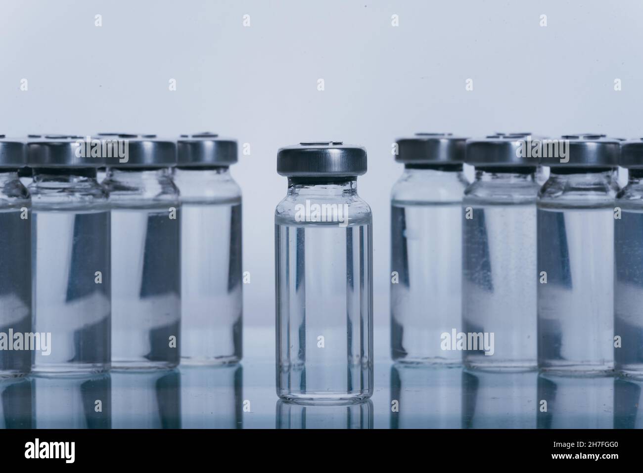 Glass medical ampoule vial for injection. Medicine is dry white drug ...