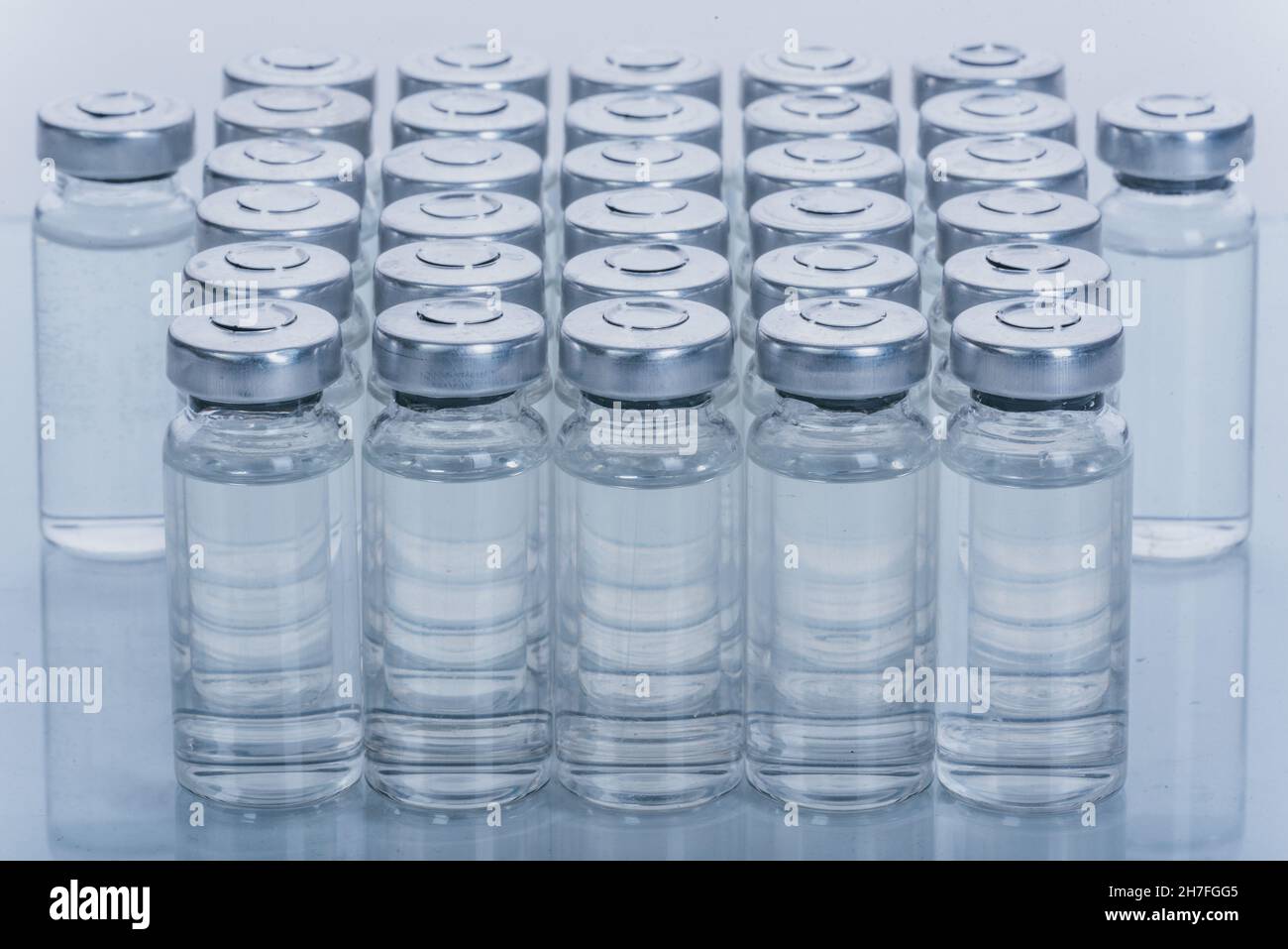 Glass medical ampoule vial for injection. Medicine is dry white drug ...