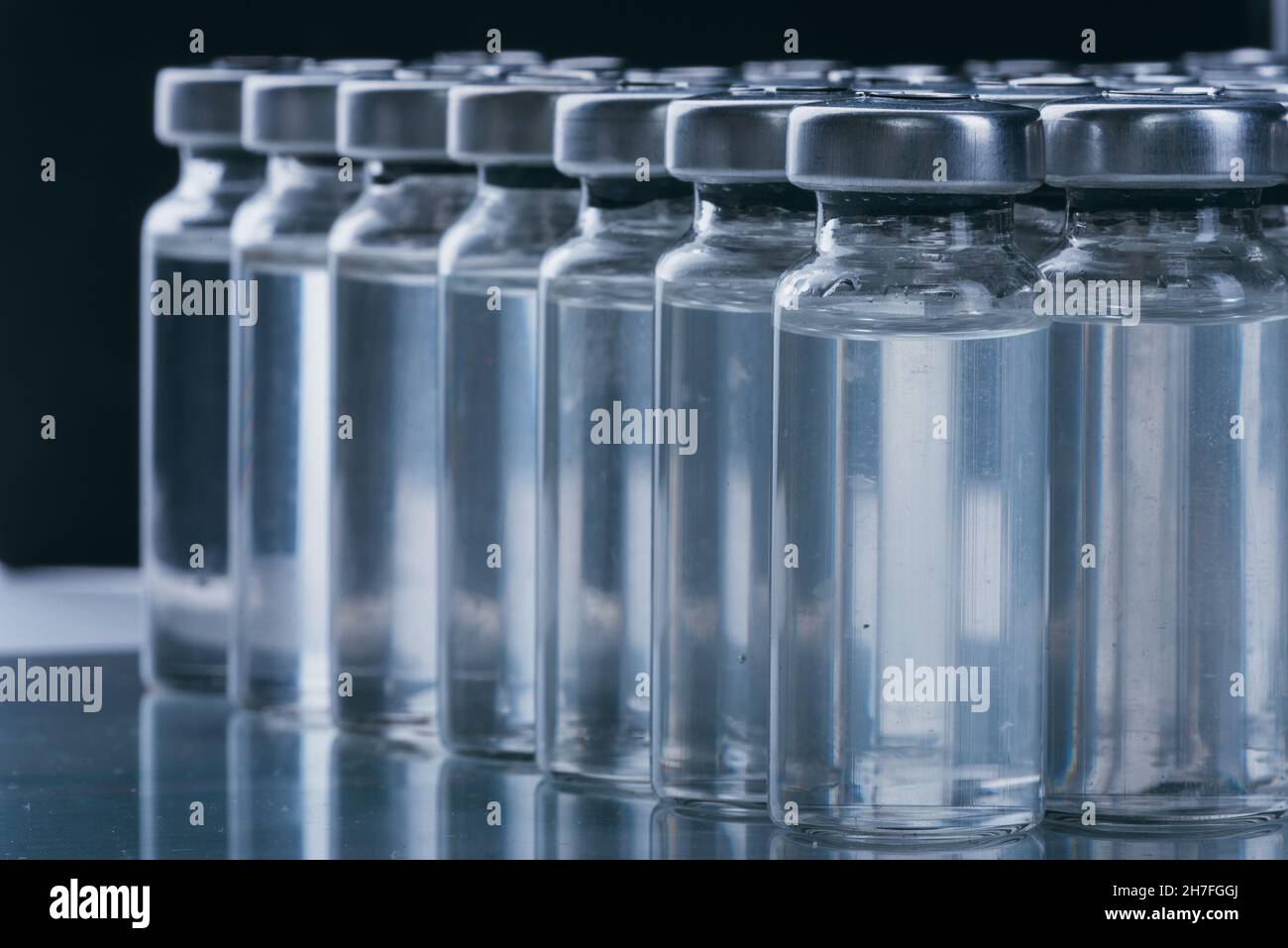 Glass medical ampoule vial for injection. Medicine is dry white drug ...