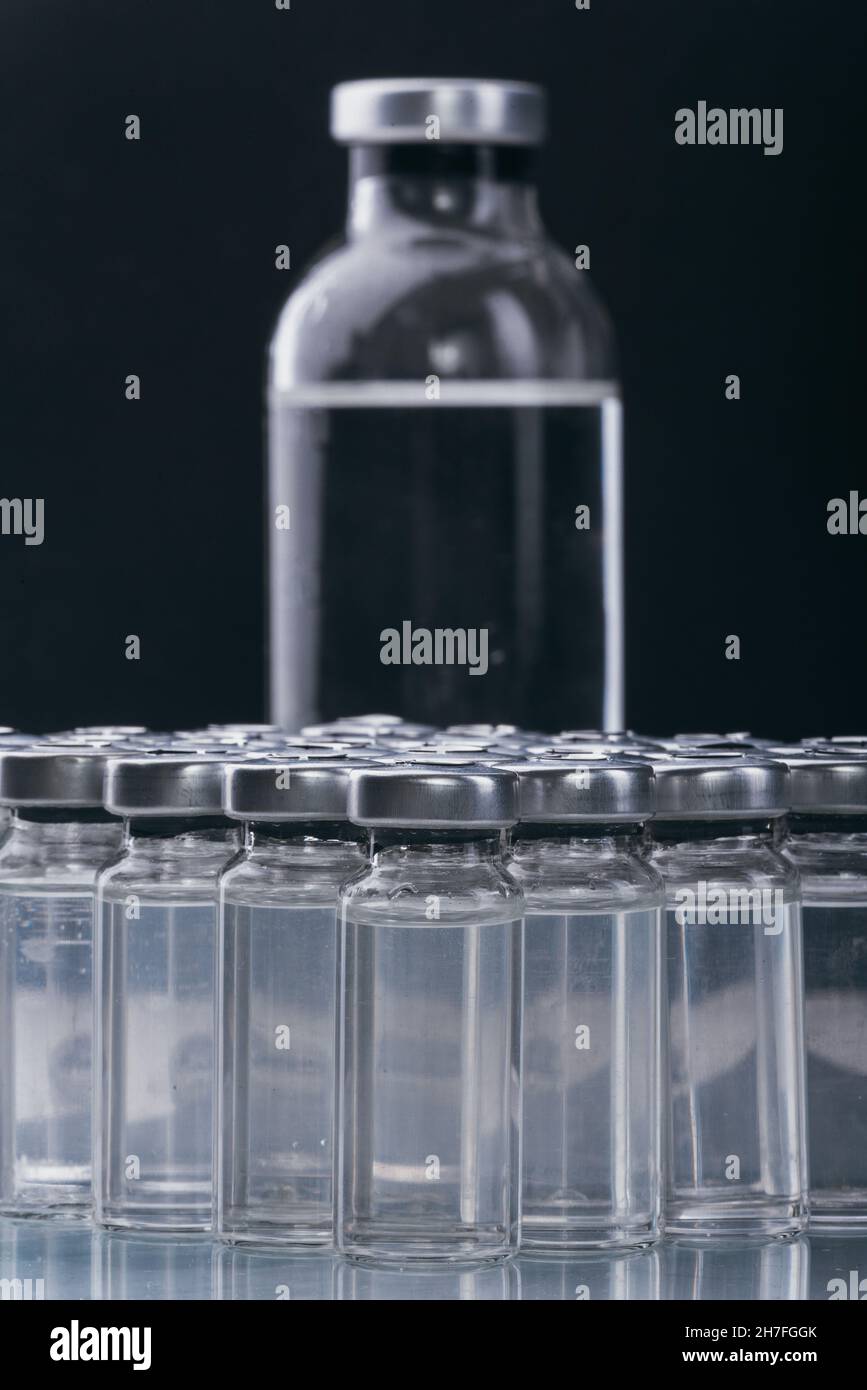 Glass medical ampoule vial for injection. Medicine is dry white drug ...