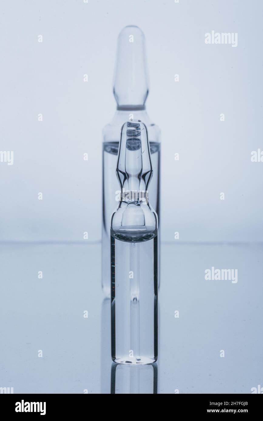 Glass medical ampoule vial for injection. Medicine is dry white drug ...