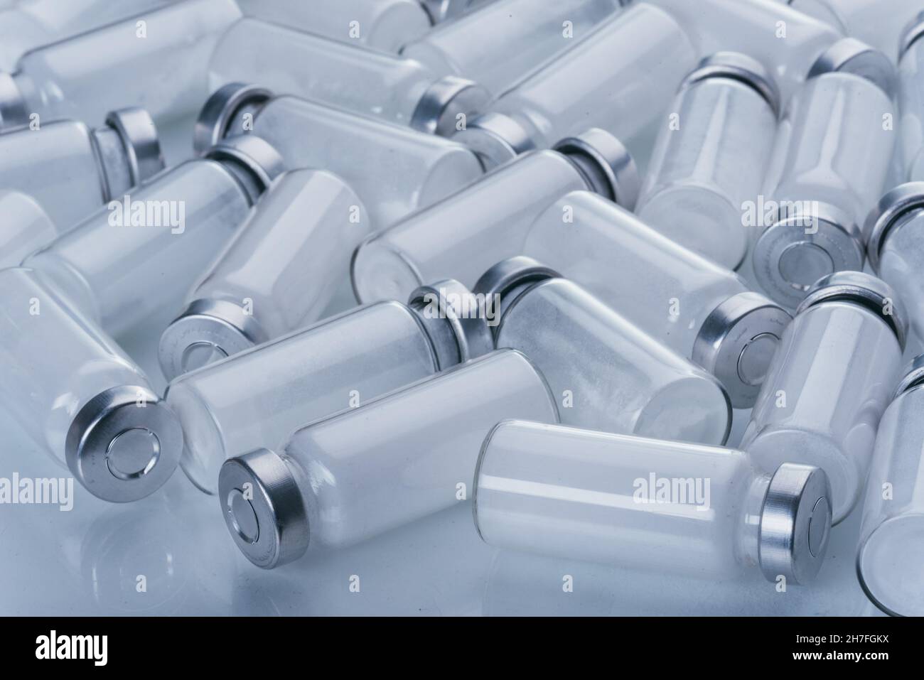 Glass medical ampoule vial for injection. Medicine is dry white drug ...