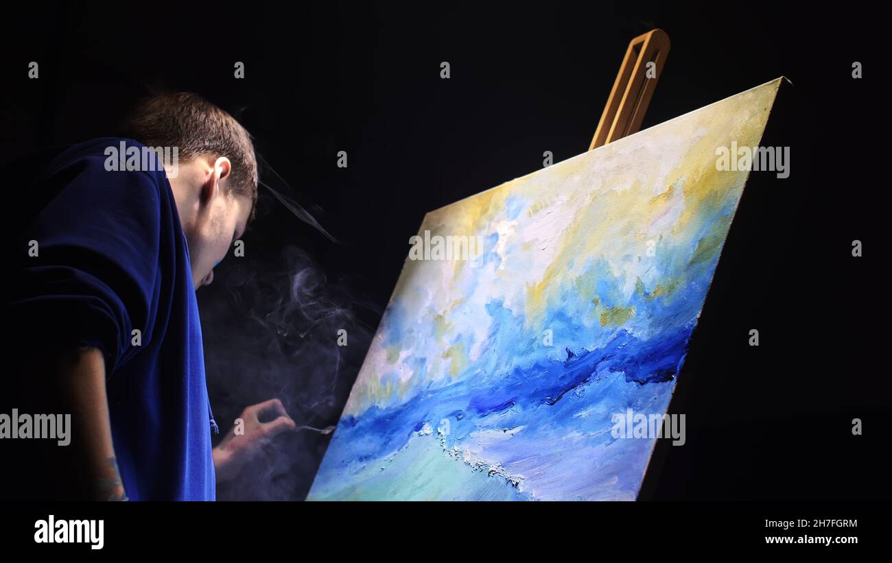 Artist copyist paint seascape with ship in ocean. Vaper smoke vape e ...