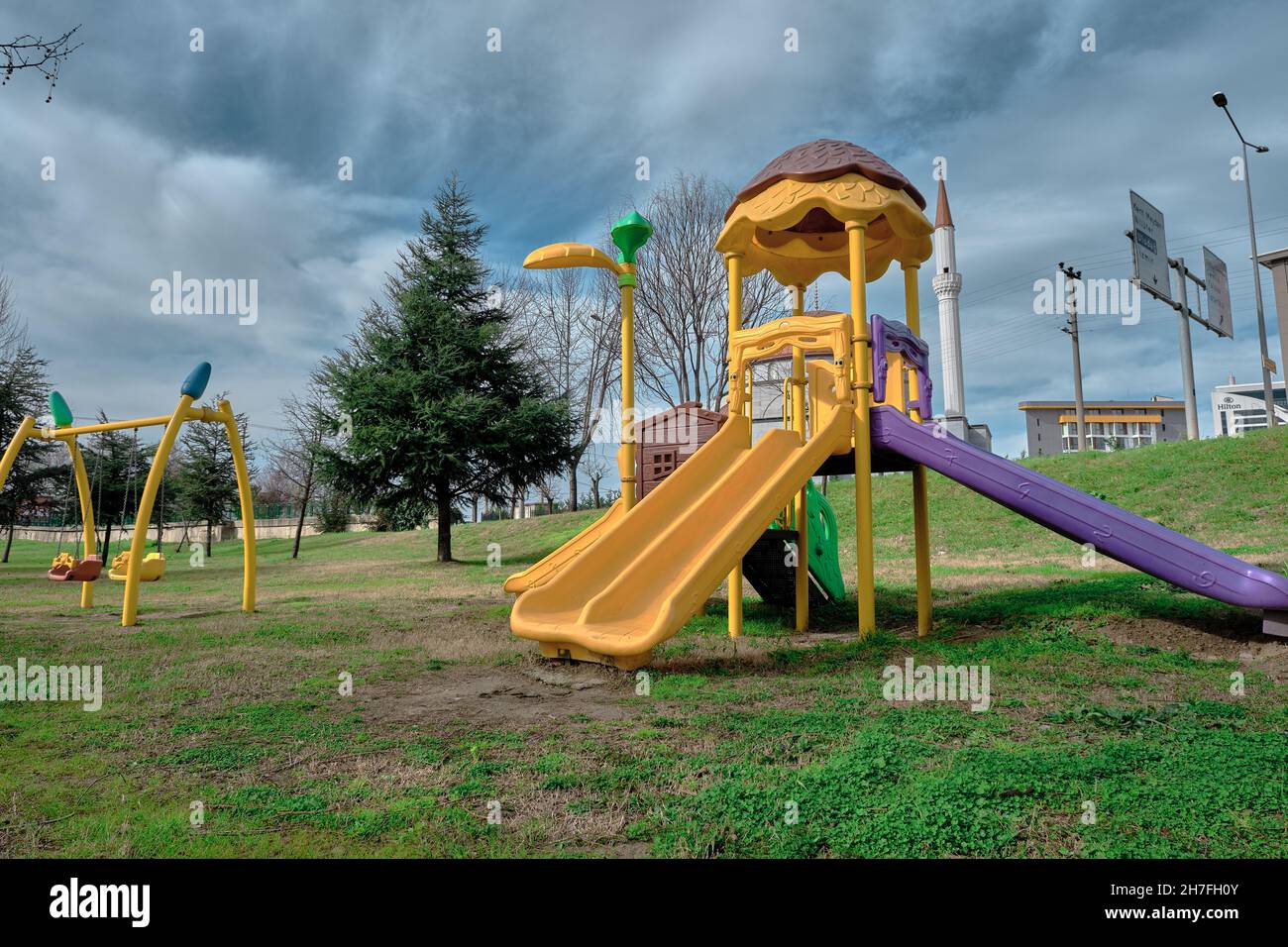 Colorful playground on green grass and walking path together with Huge ...